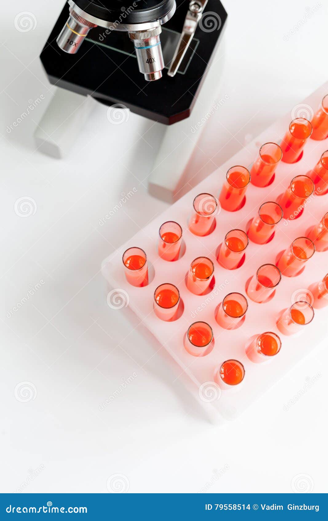 Blood in Glass Tubes on Background of Microscope Top View Stock Photo ...
