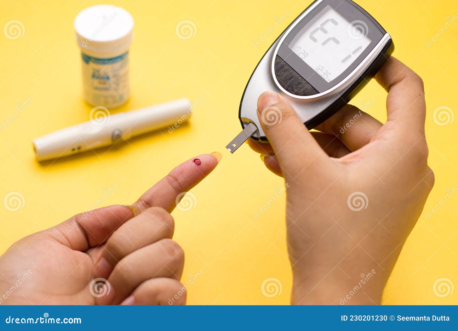 Blood Glucose Meter, the Blood Sugar Value is Measured on a Finger on ...