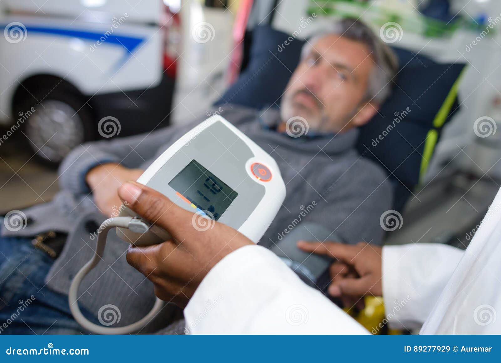 Blood Pressure Reading Man on Stretcher Stock Image - Image of ...