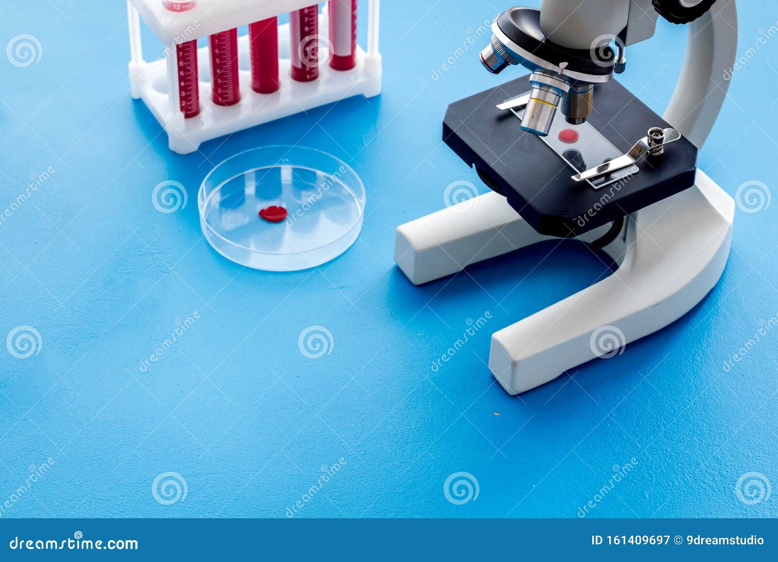 Blood Testing Laboratory. Samples Viewing Under Microscope Near Tubes ...