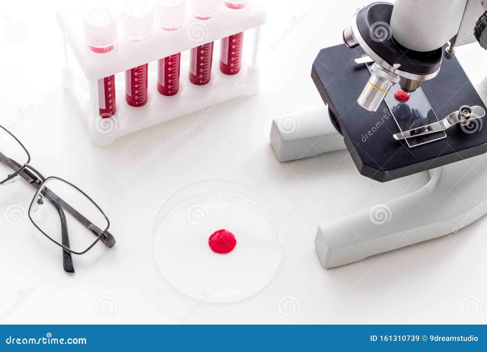 Blood Testing Laboratory. Samples Viewing Under Microscope Near Tubes ...