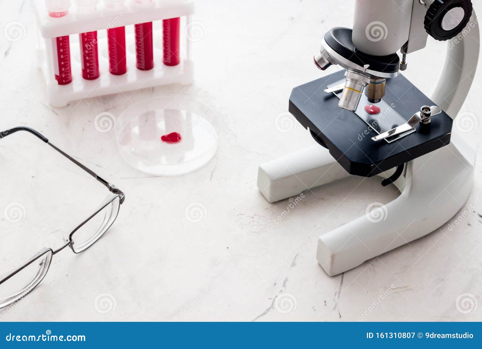 Blood Testing Laboratory. Samples Viewing Under Microscope Near Tubes ...