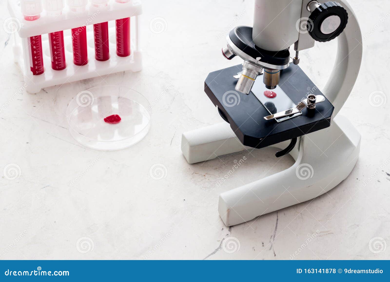 Blood Testing Laboratory. Samples Viewing Under Microscope Near Tubes ...