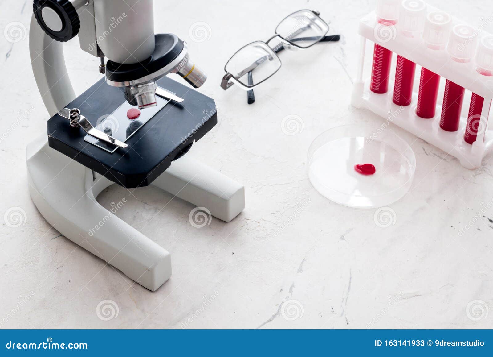 Blood Testing Laboratory. Samples Viewing Under Microscope Near Tubes ...