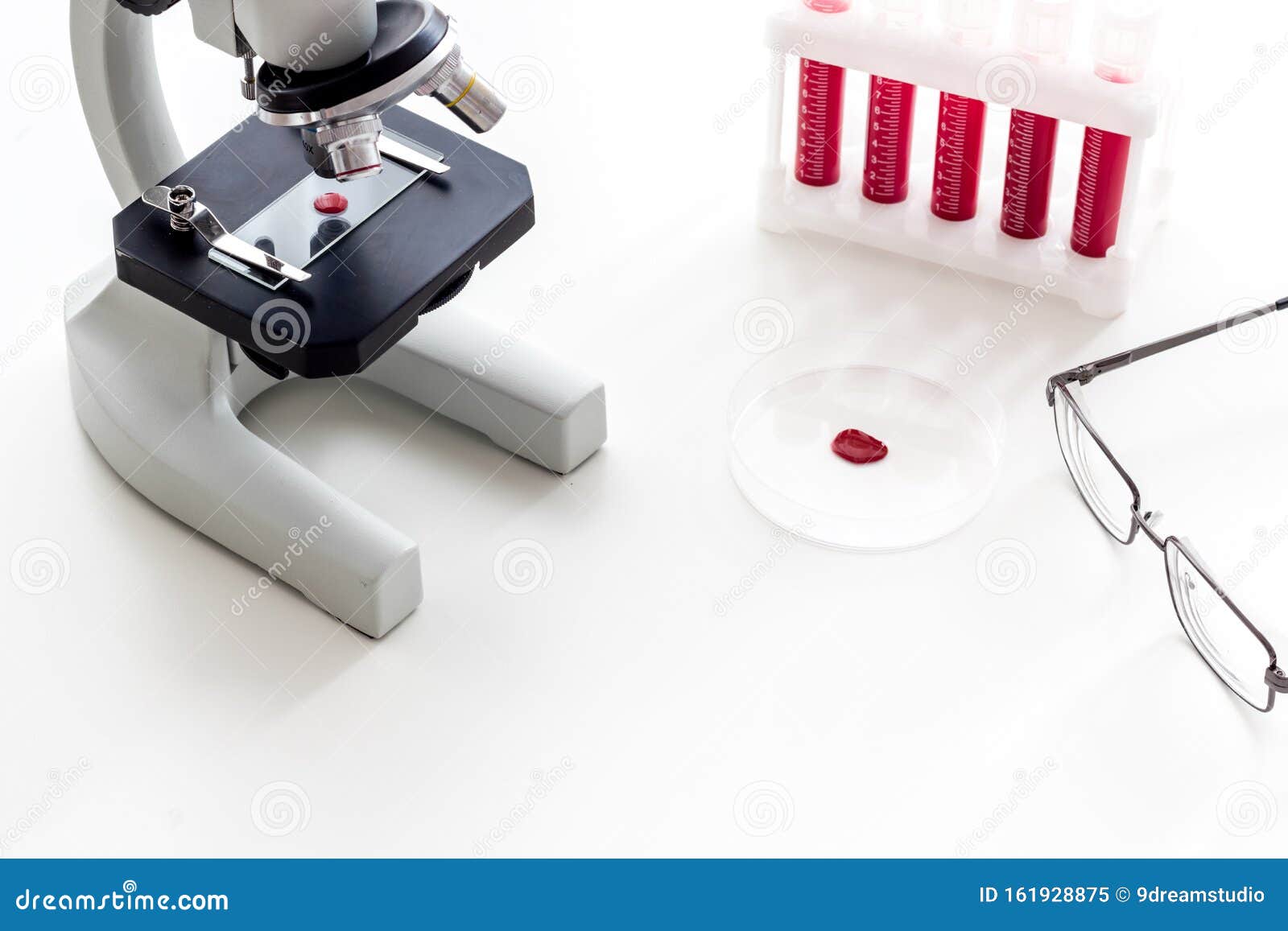Blood Testing Laboratory. Samples Viewing Under Microscope Near Tubes ...