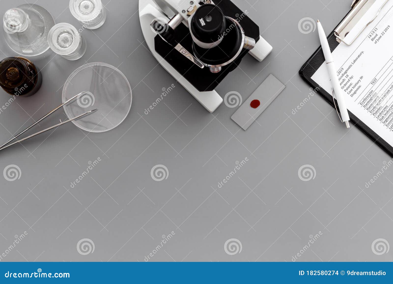 Blood Testing with Microscope in Laboratory. Equipment on Grey ...