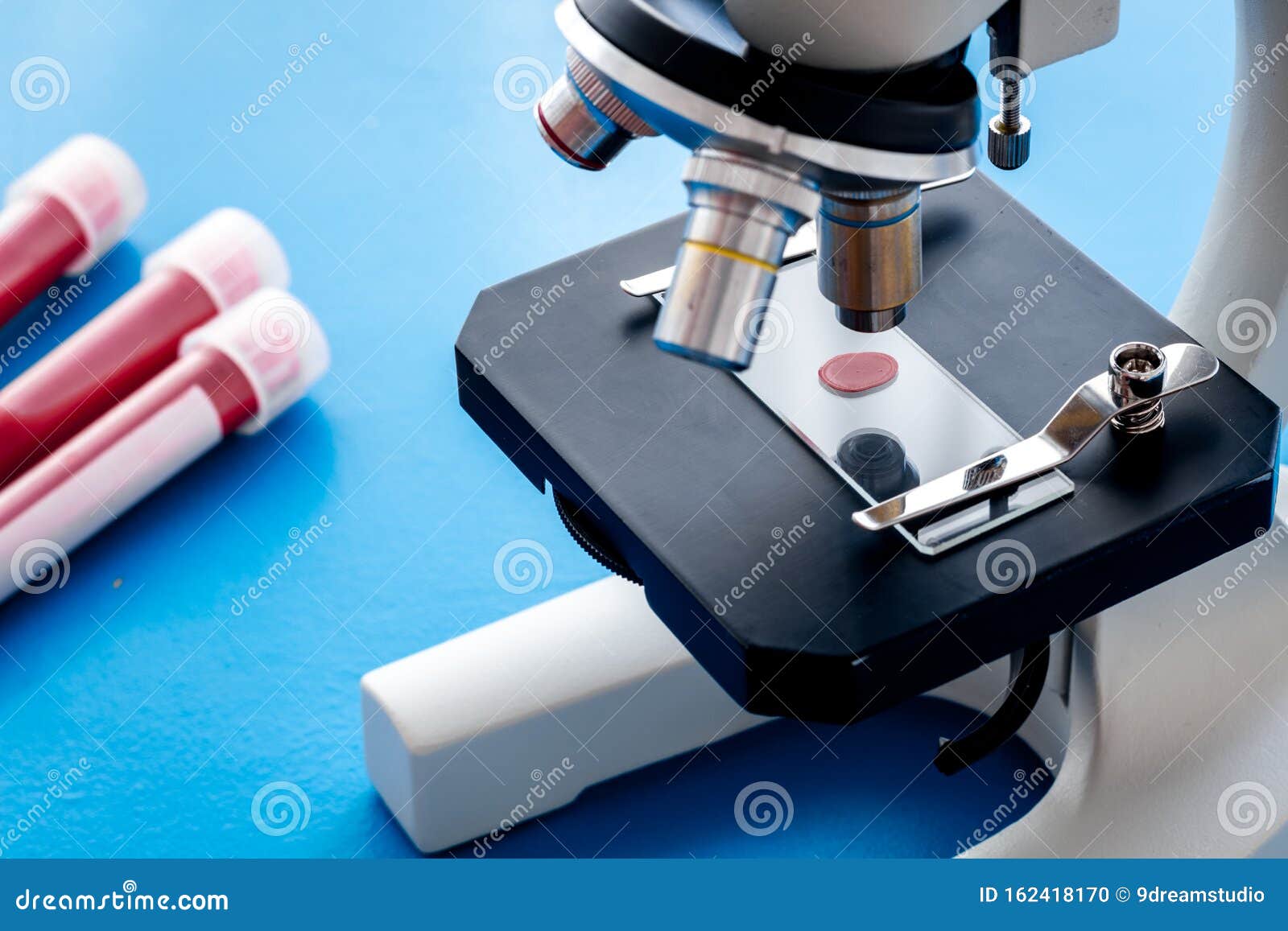 Blood Testing. Samples Viewing Undermicroscope on Blue Background Top ...
