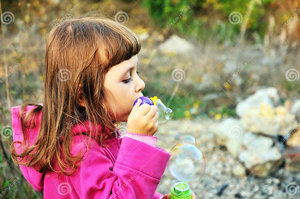Blowing girl stock image. Image of park, blow, beautiful - 14156289