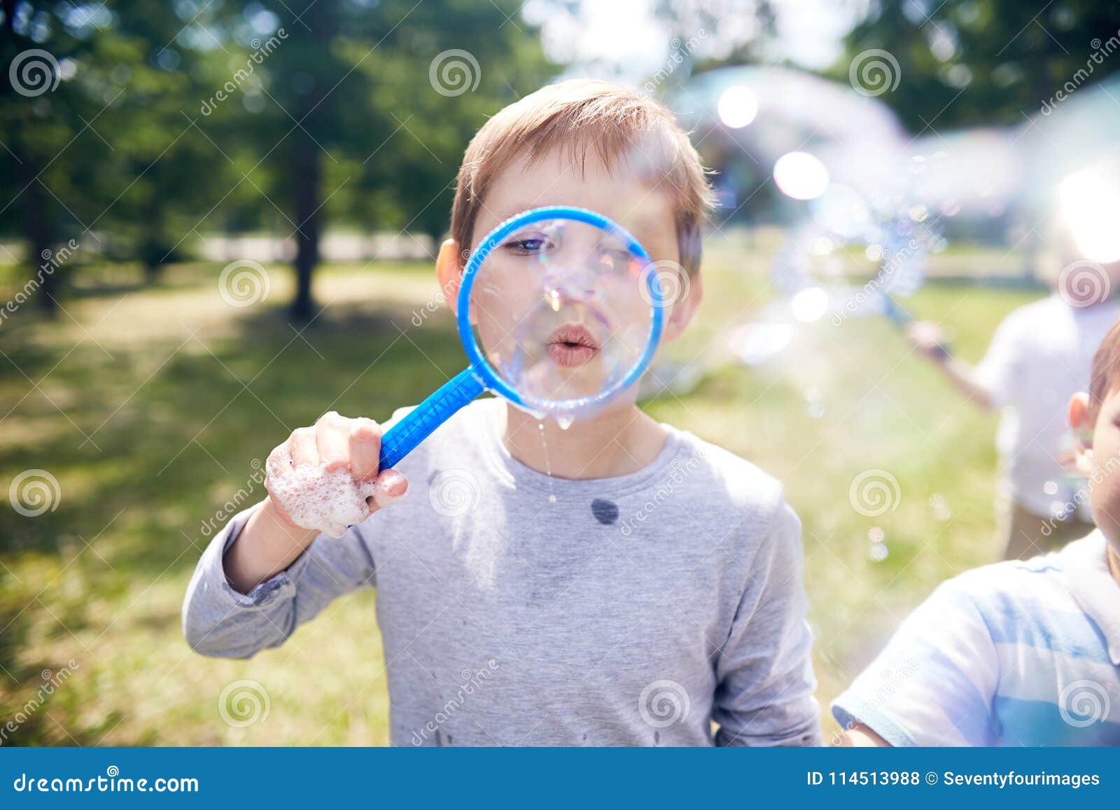 Blowing Soap Bubbles in Park Stock Photo - Image of waistup, adorable ... Blowing Soap Bubbles in Park Stock Photo - Image of waistup, adorable ...