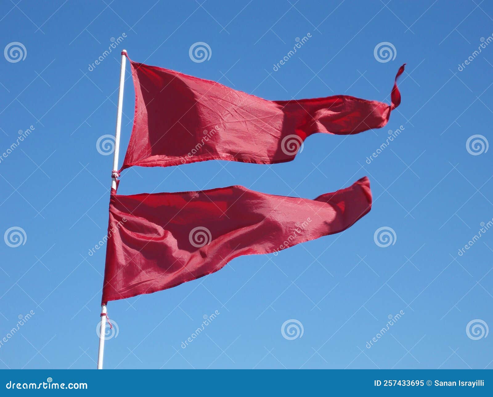 Blowing in the wind stock image. Image of sunny, pole - 257433695