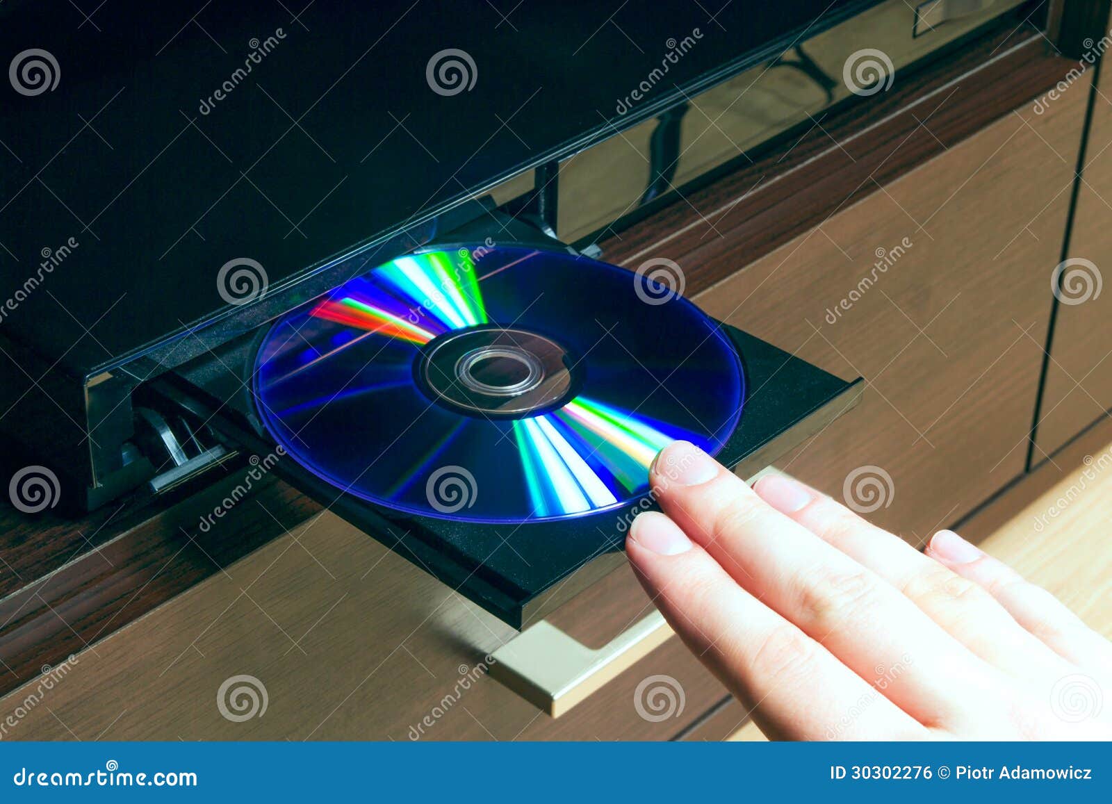 Blu-ray or DVD player stock photo. Image of hand, inserting - 30302276