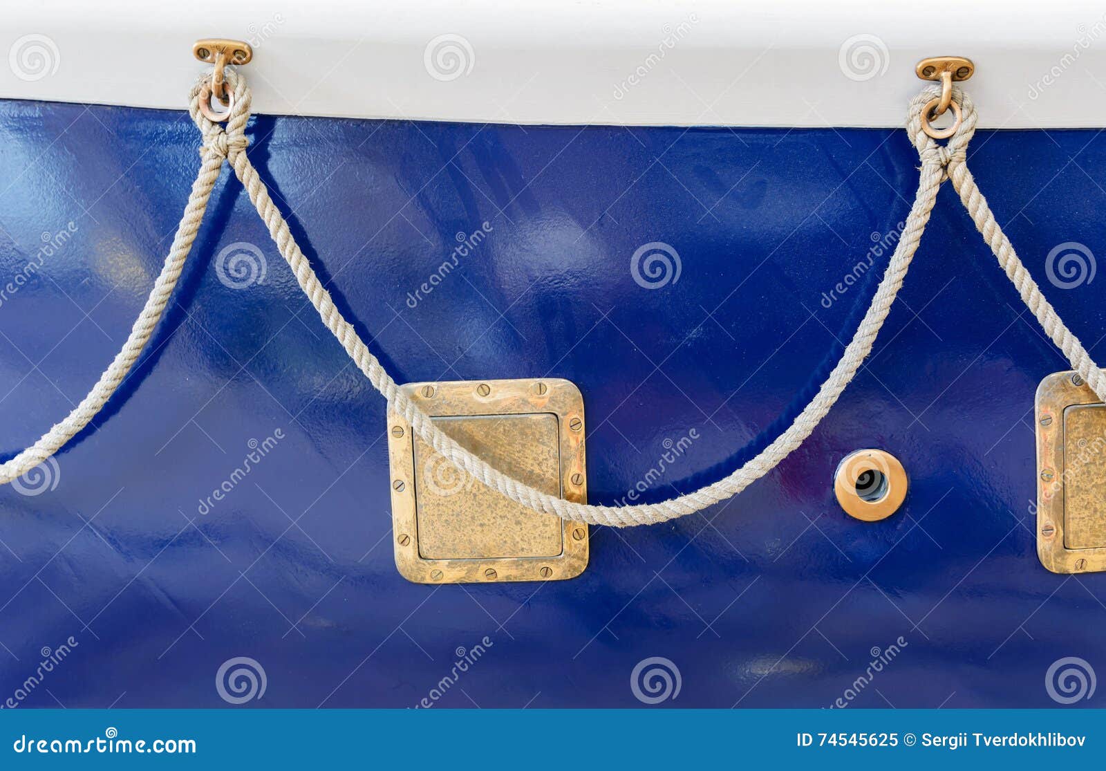 Blue Aboard an Old Ship and Hanging on the Rope it in Bronze Eyelets ...