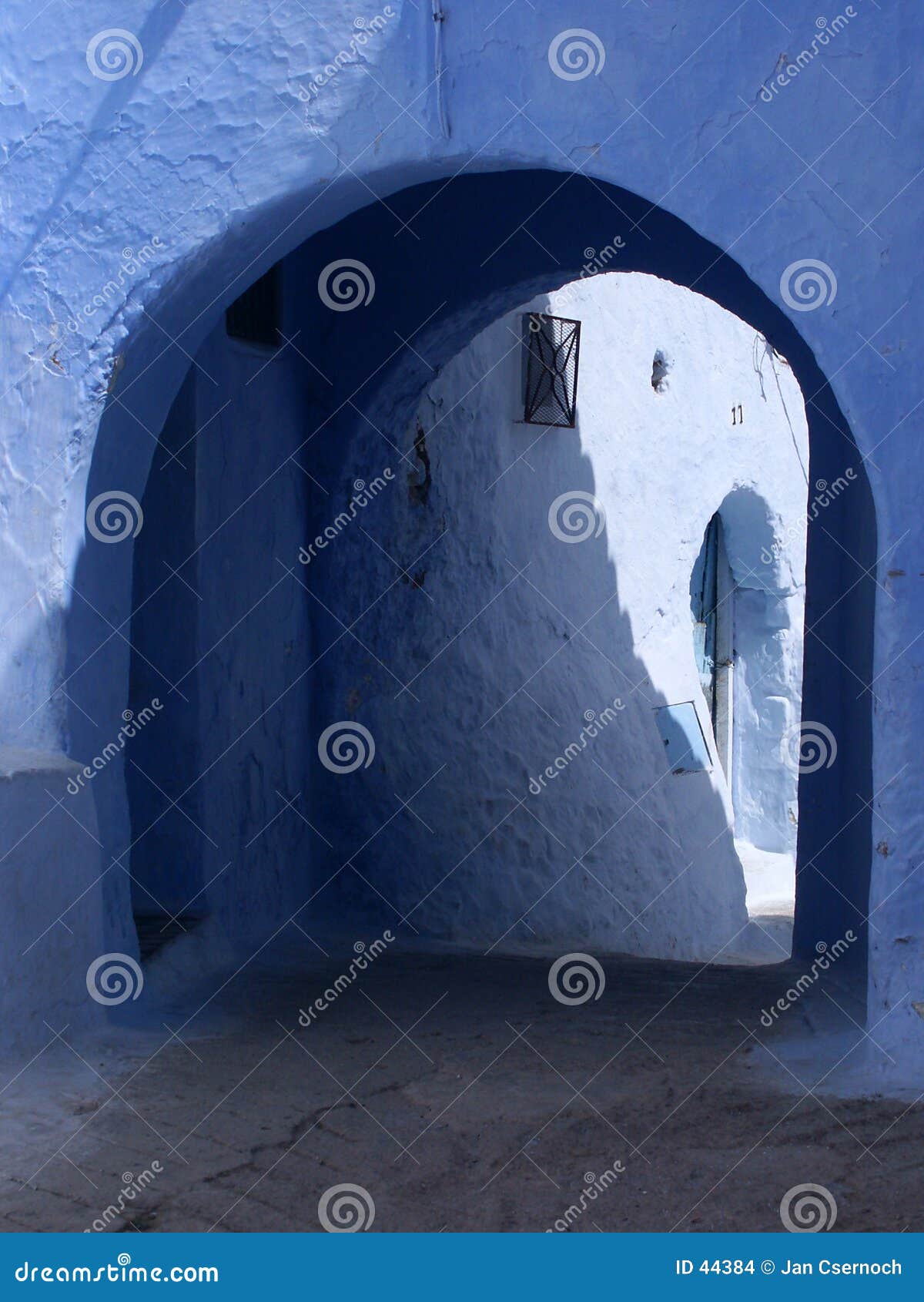 Blue alley with passage stock photo. Image of narrow, doors - 44384