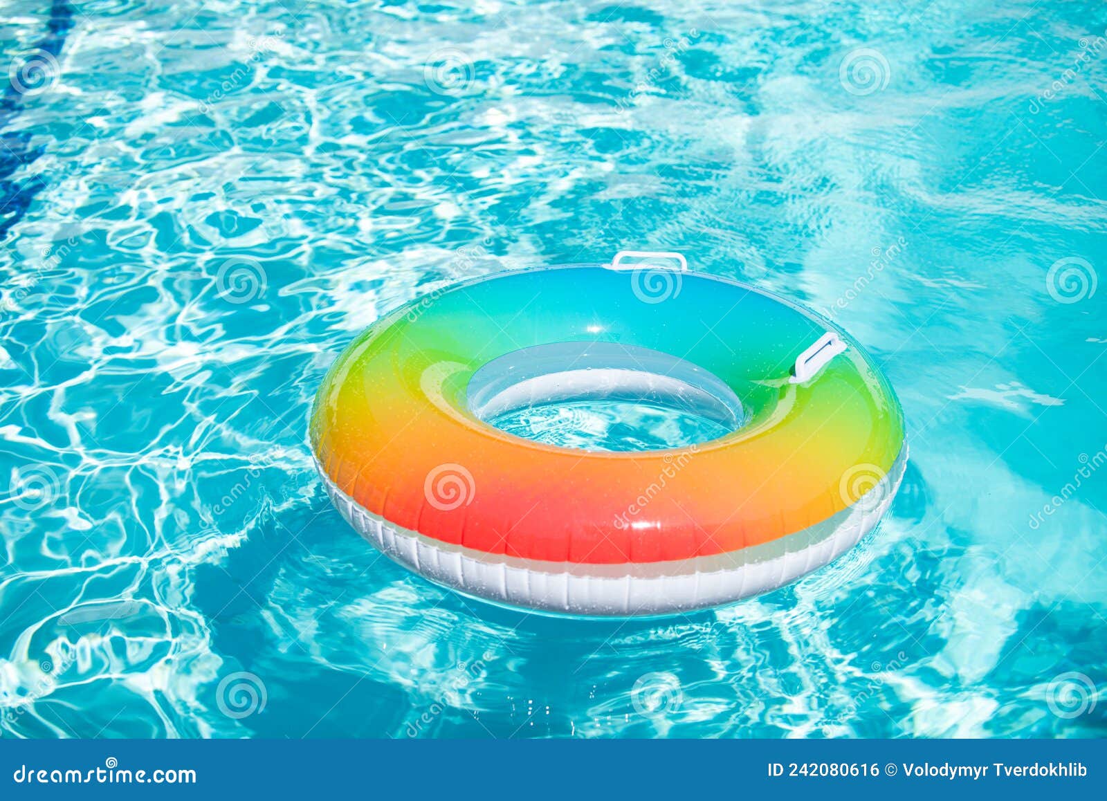 Blue Aqua Background. Pool Float, Rainbow Ring Floating in a Refreshing ...