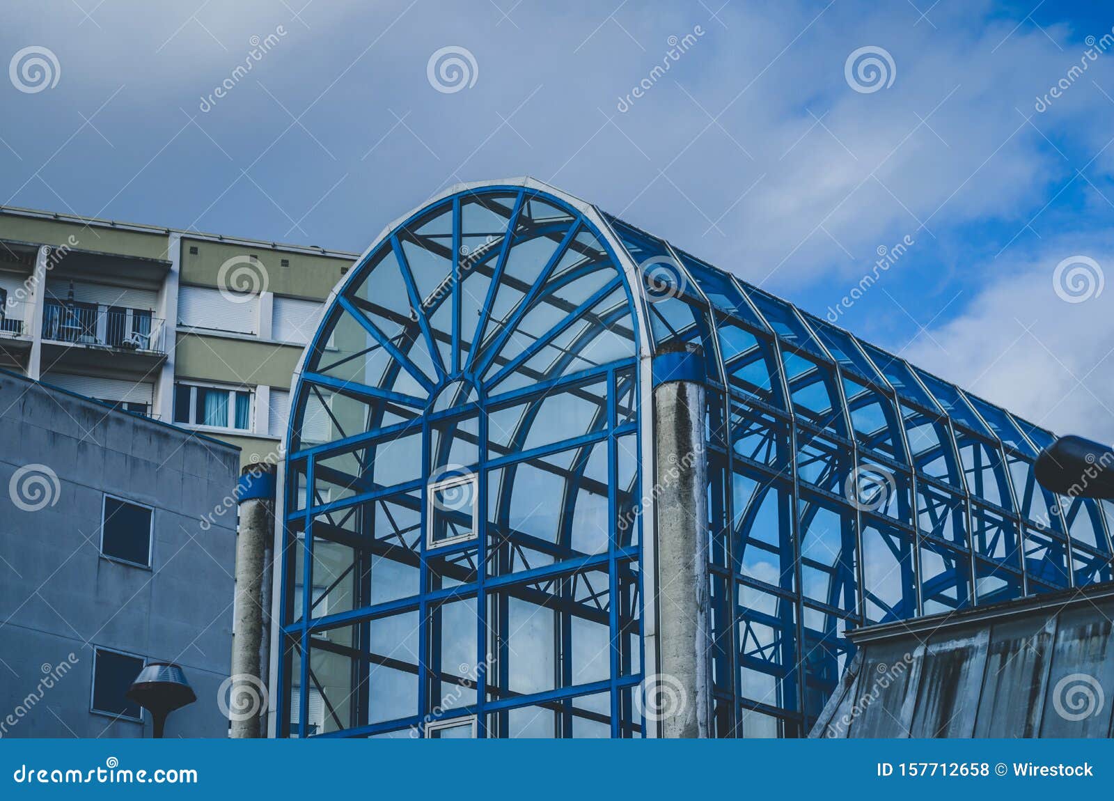 Blue Architectural Building in the Shape of an Arch Under a Blue Sky ...