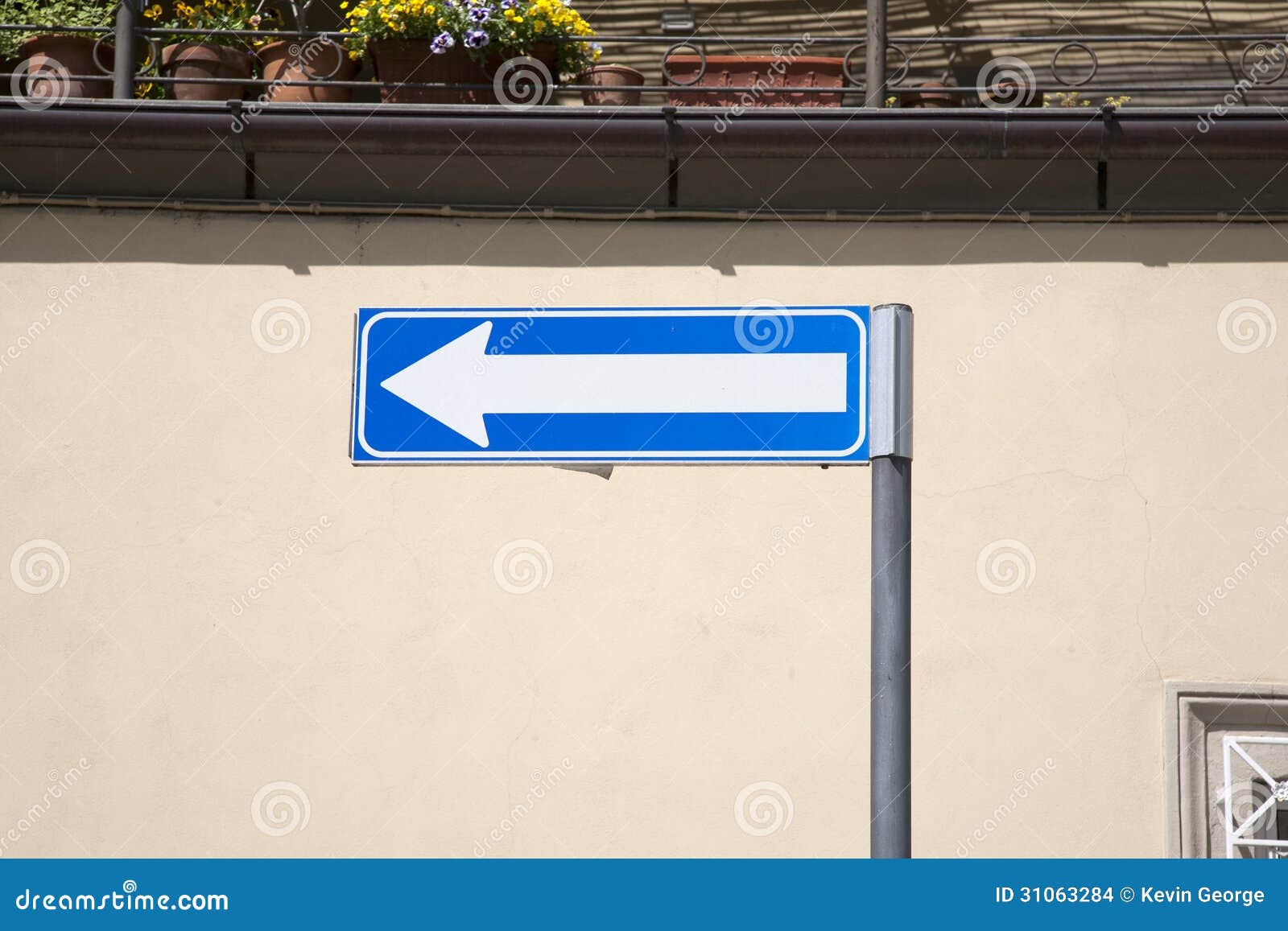 Blue Arrow Sign stock photo. Image of sign, wall, direction - 31063284