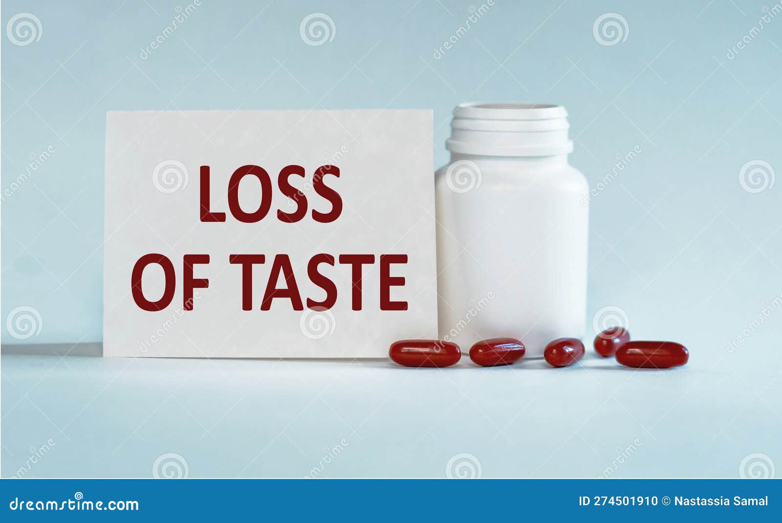 On a Blue Background a Card with the Text LOSS of TASTE Stock Photo ...