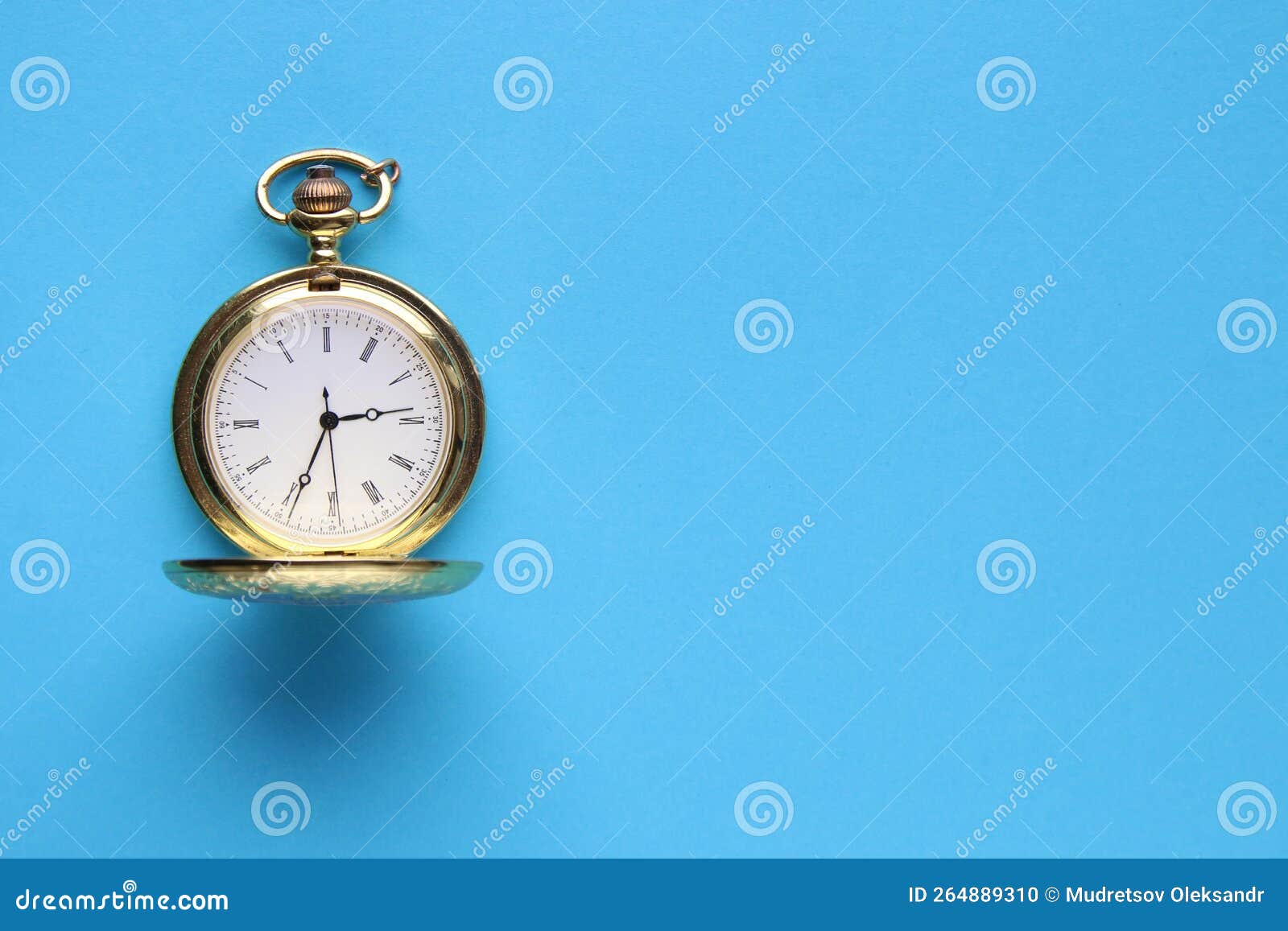 Blue Background. Golden Pocket Watch on a Blue Background Stock Photo ...