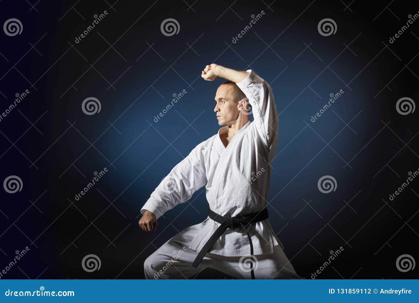 On a Blue Background with a Gradient Adult Athlete Performs Formal ...