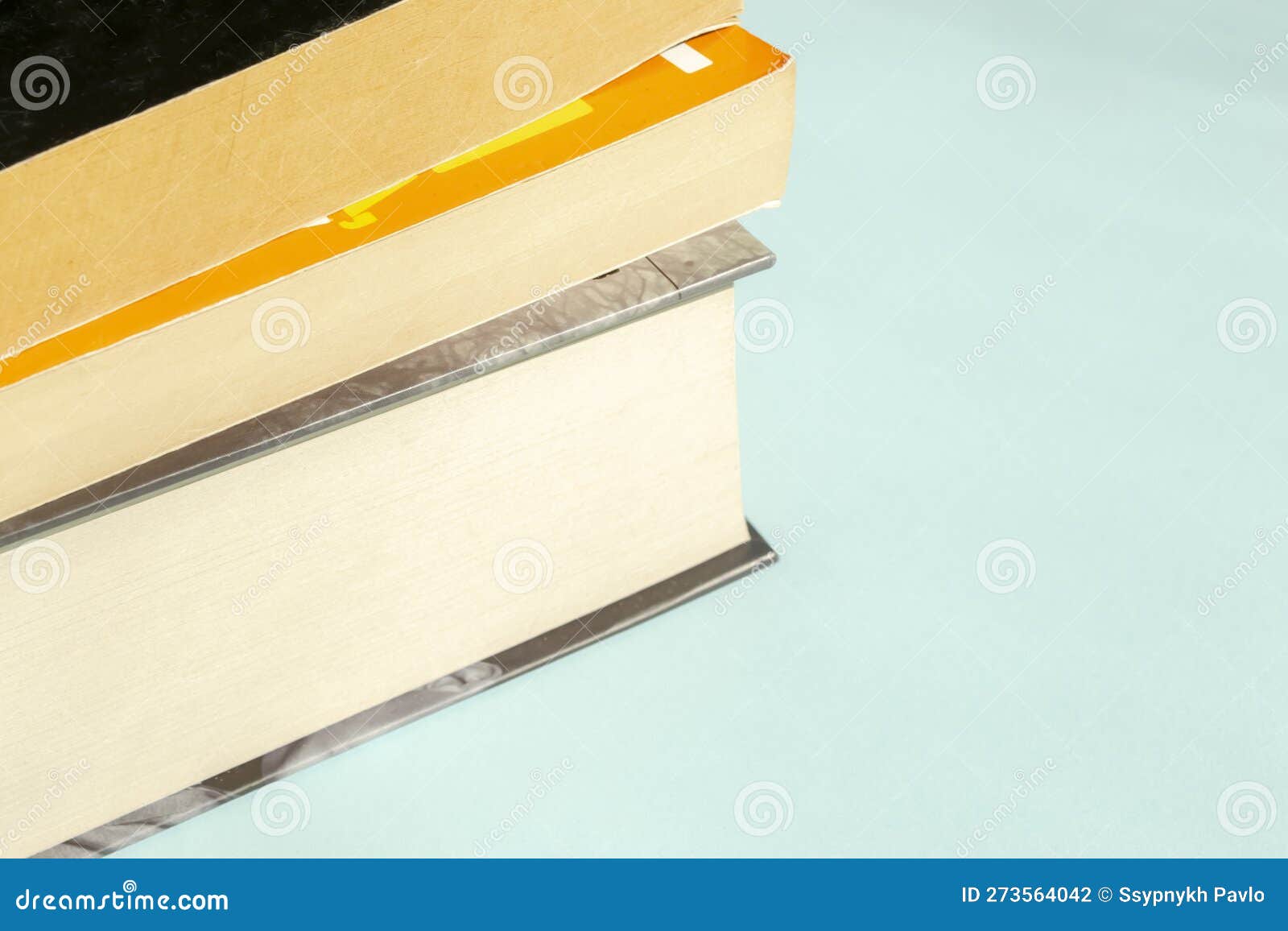 On a Blue Background Lies a Stack of Books. Light Background for ...