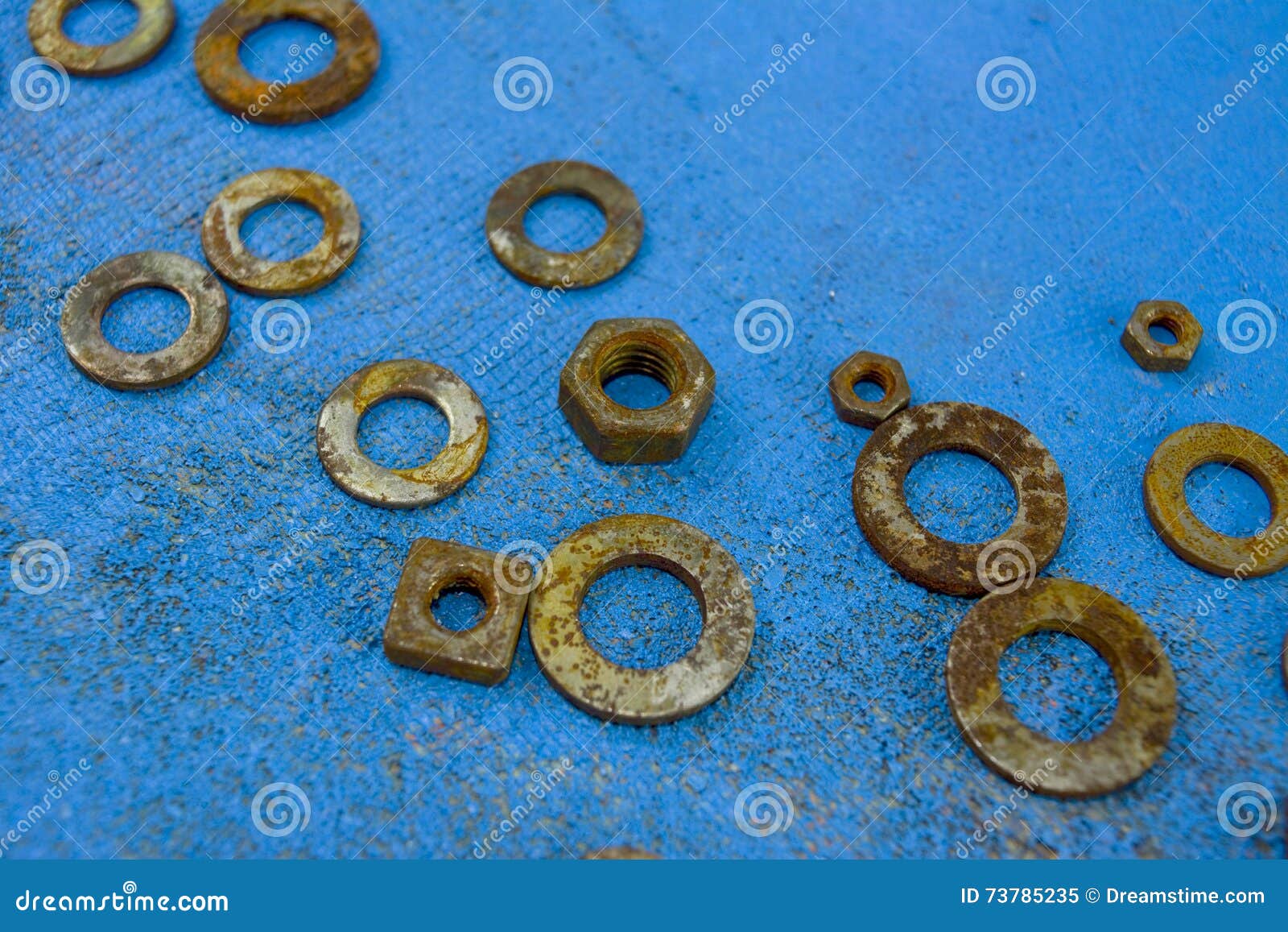 Blue Background with Rusty Washers Stock Image - Image of metallic ...