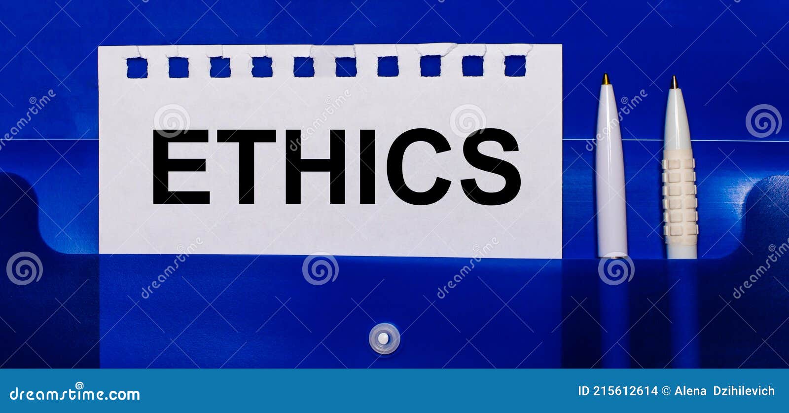On a Blue Background, White Pens and a Sheet of Paper with the Text ...