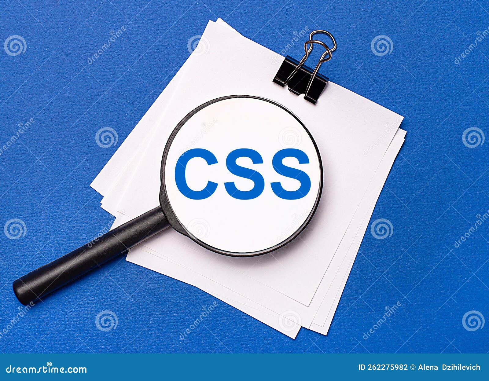 On a Blue Background, White Sheets Under a Black Paper Clip and on Them ...