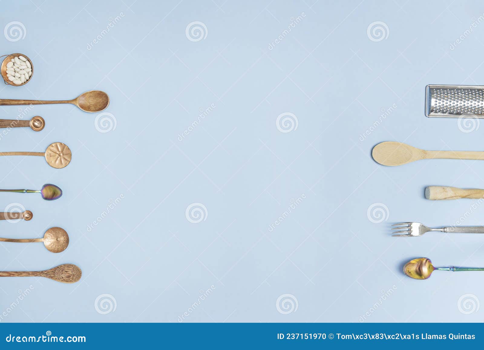Blue Background with Wooden and Copper Kitchen Utensils Stock Photo ...