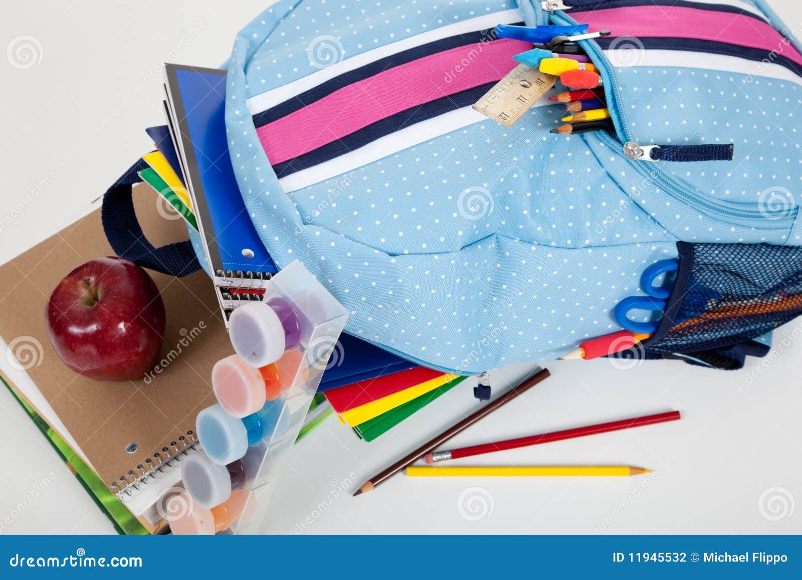 Blue Backpack Full of Supplies on White Stock Photo - Image of paper ...