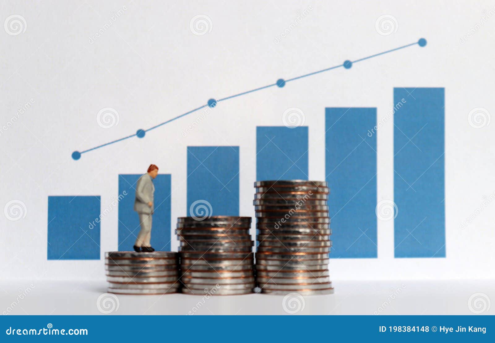 Blue Bar Graph With Flow Linear Graph. The Stack Of Coins And Miniature ...