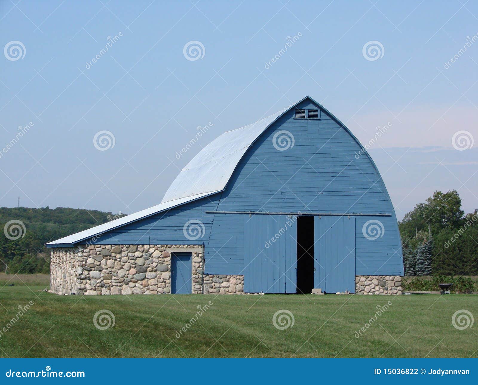 Blue Barn with Stone Foundation Stock Photo - Image of metal, stone ...