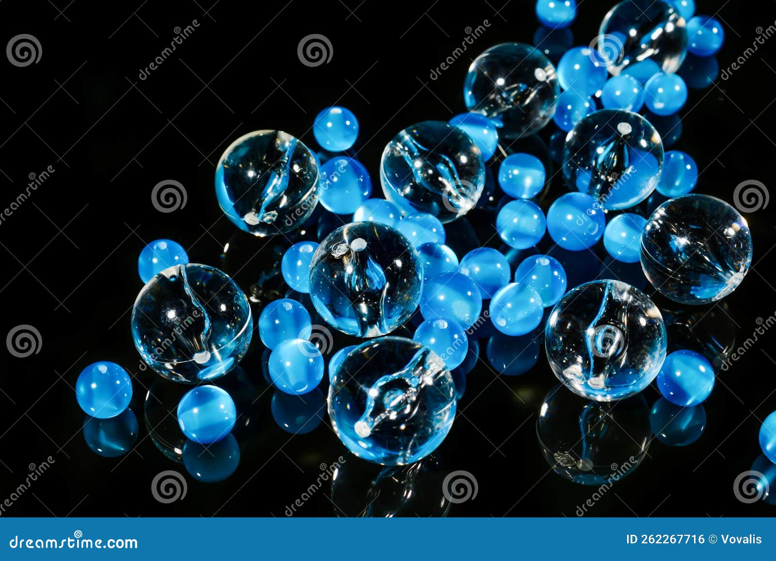 Blue Beads Balls on Black Mirror Background Stock Photo - Image of ...