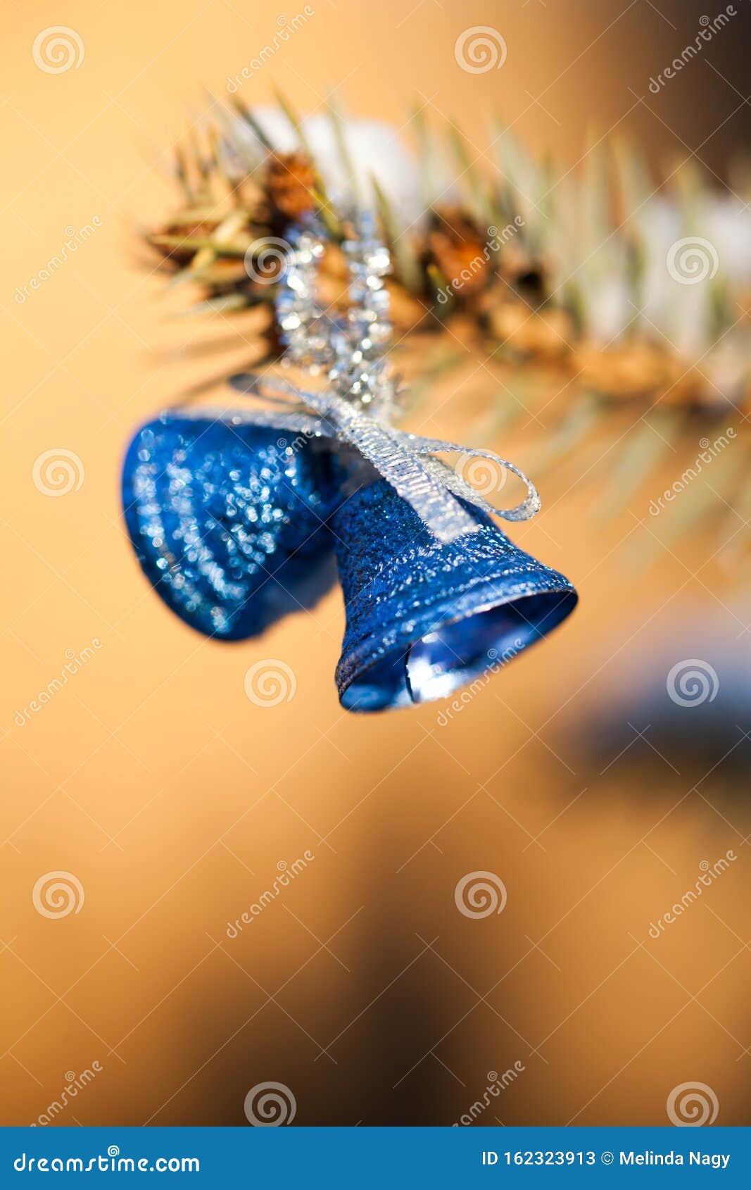 Blue Bells Christmas Decoration Hanging on Snowy Tree Stock Image ...