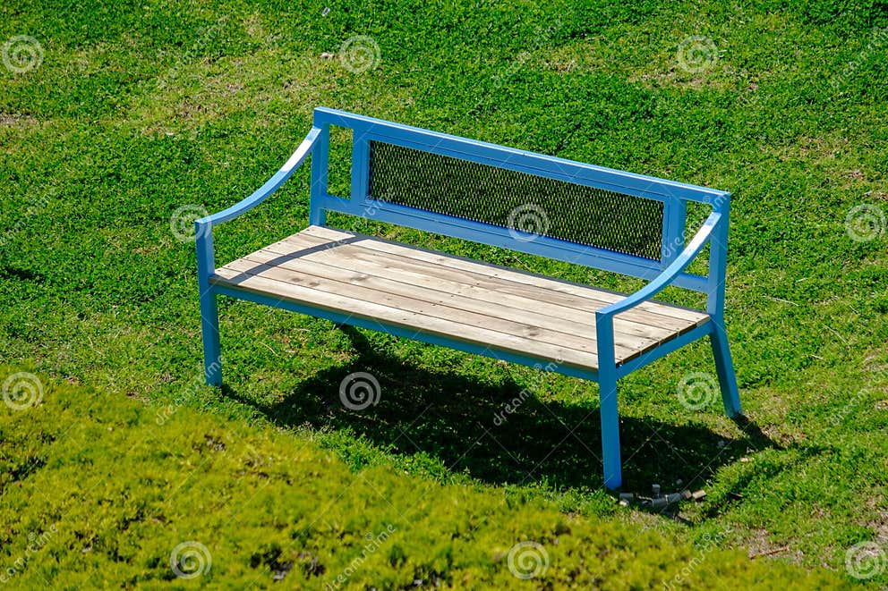 Blue Bench on Grass at a Park. Suitable As a Background Stock Image ...