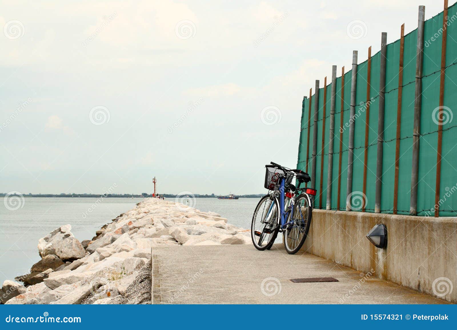 Blue Bike Parked by Rock Path Leading into the Sea Stock Image - Image ...