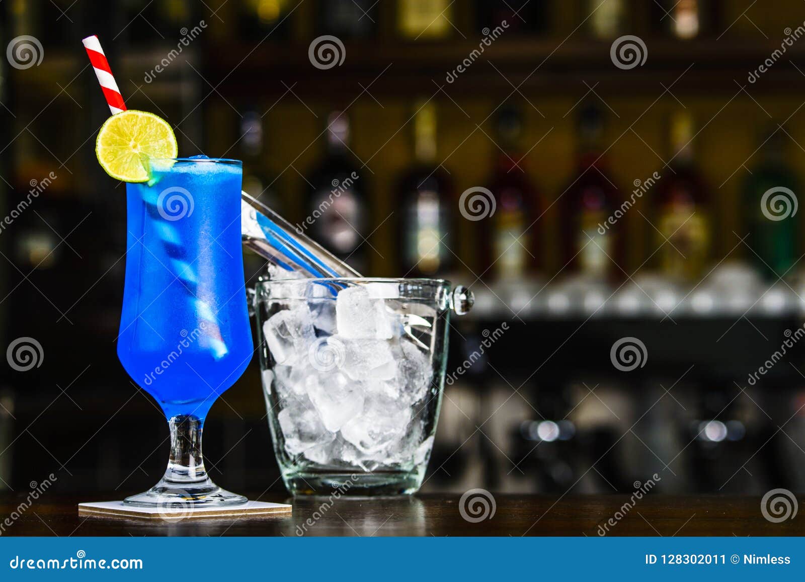 Blue Bird Cocktail on the Bar Tender Stock Image - Image of cold ...