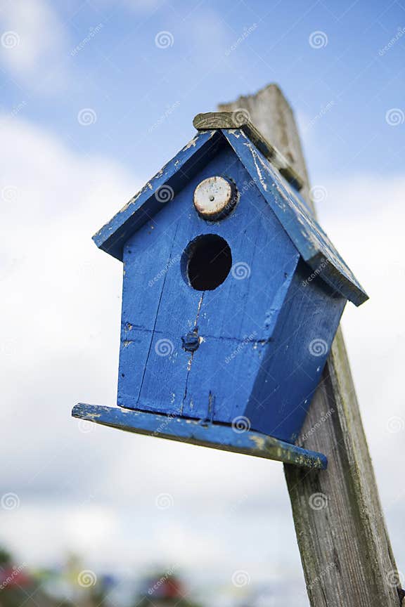 Blue Bird House in Front of Cloudy Sky Stock Photo - Image of outdoor ...