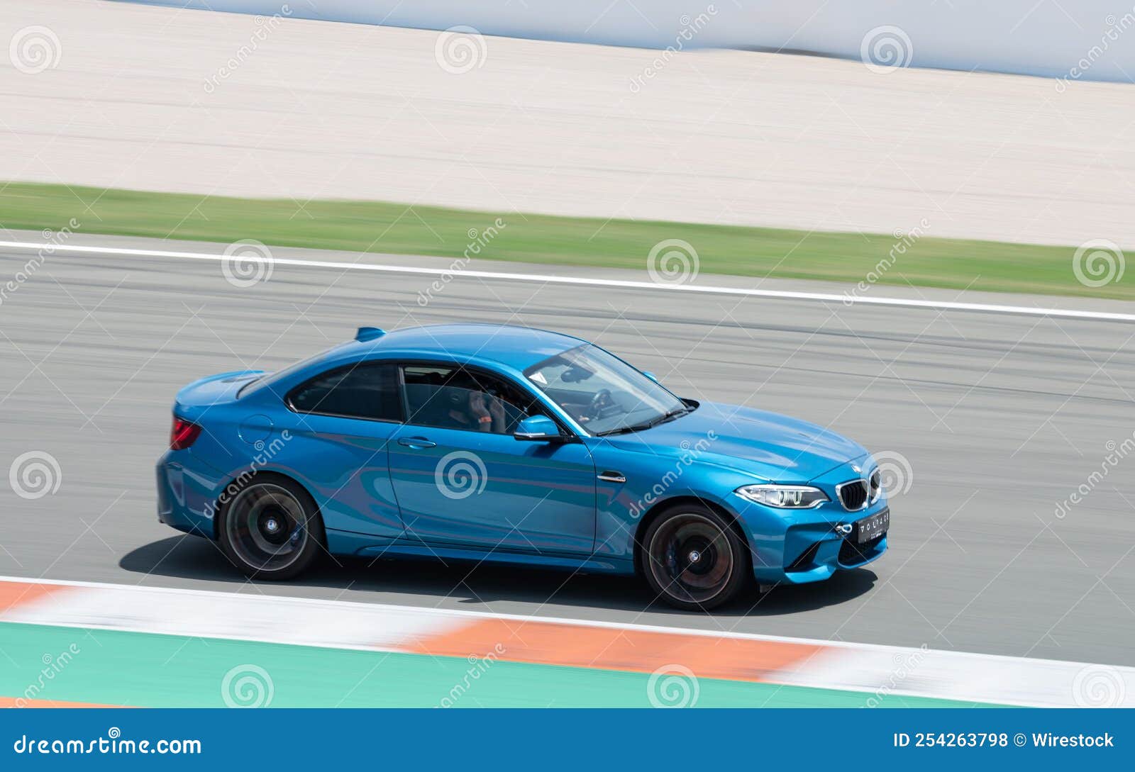 Blue BMW M2 Driving Around on a Race Track Editorial Stock Photo ...