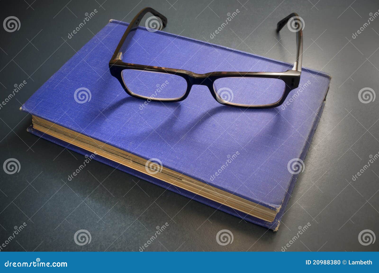 Blue Book with Reading Glasses Stock Photo - Image of shadow, teacher ...
