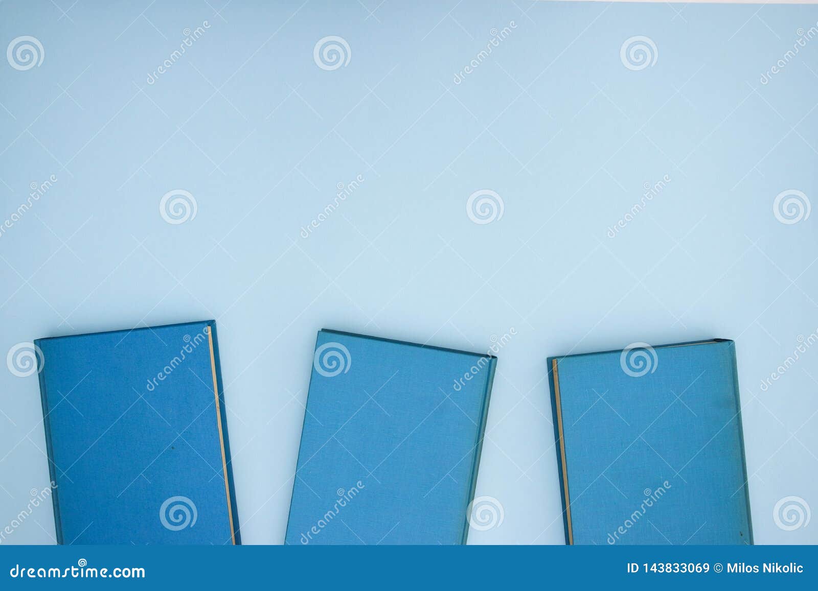 Blue Books on Blue Background Stock Image - Image of phone, read: 143833069