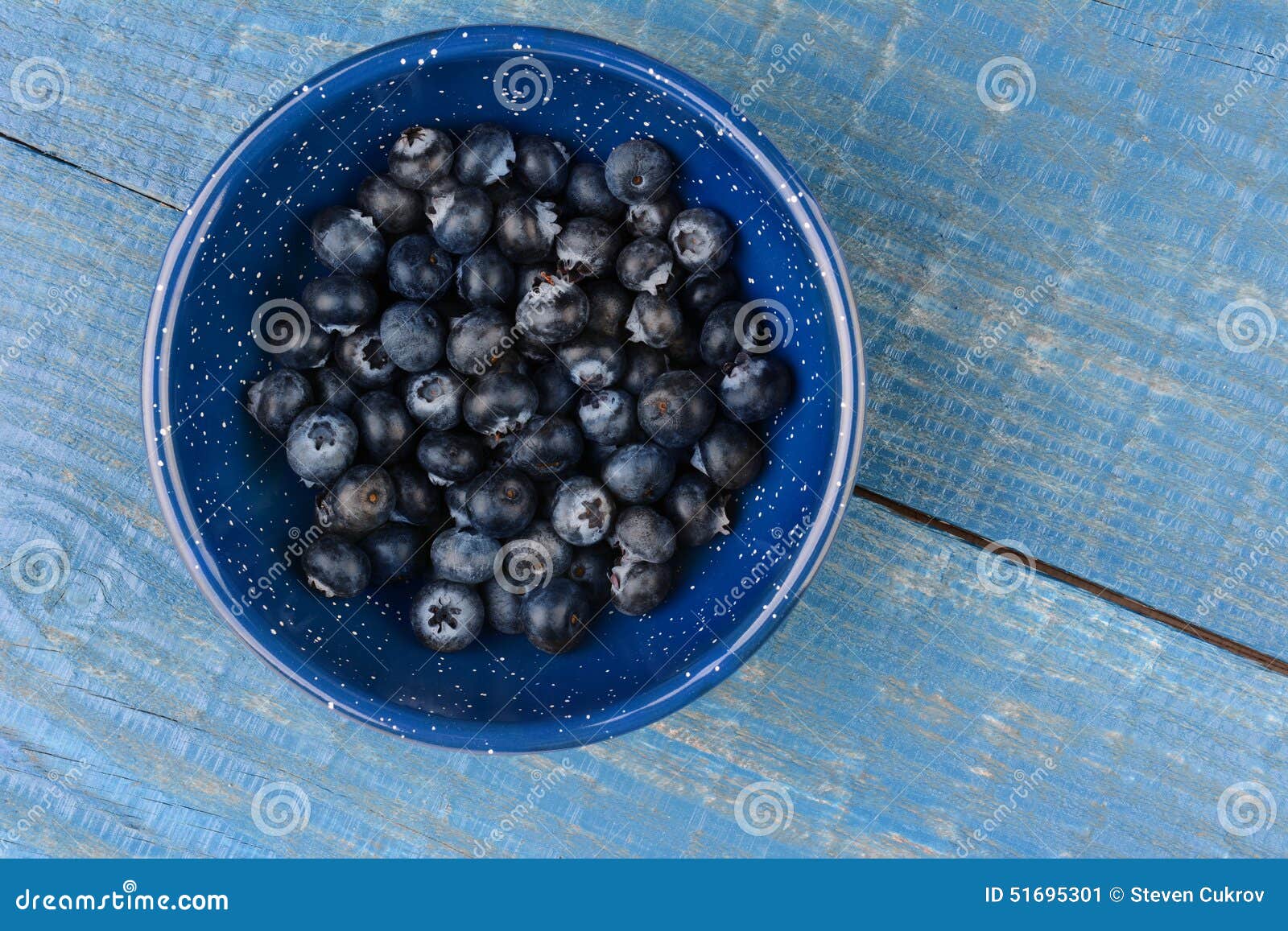 Blue Bowl of Blueberries stock image. Image of spilling - 51695301