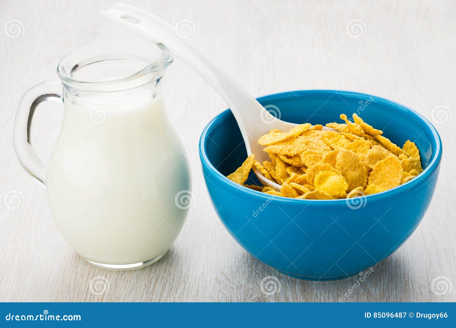 Blue Bowl with Corn Flakes and Jug of Milk Stock Image - Image of blue ...