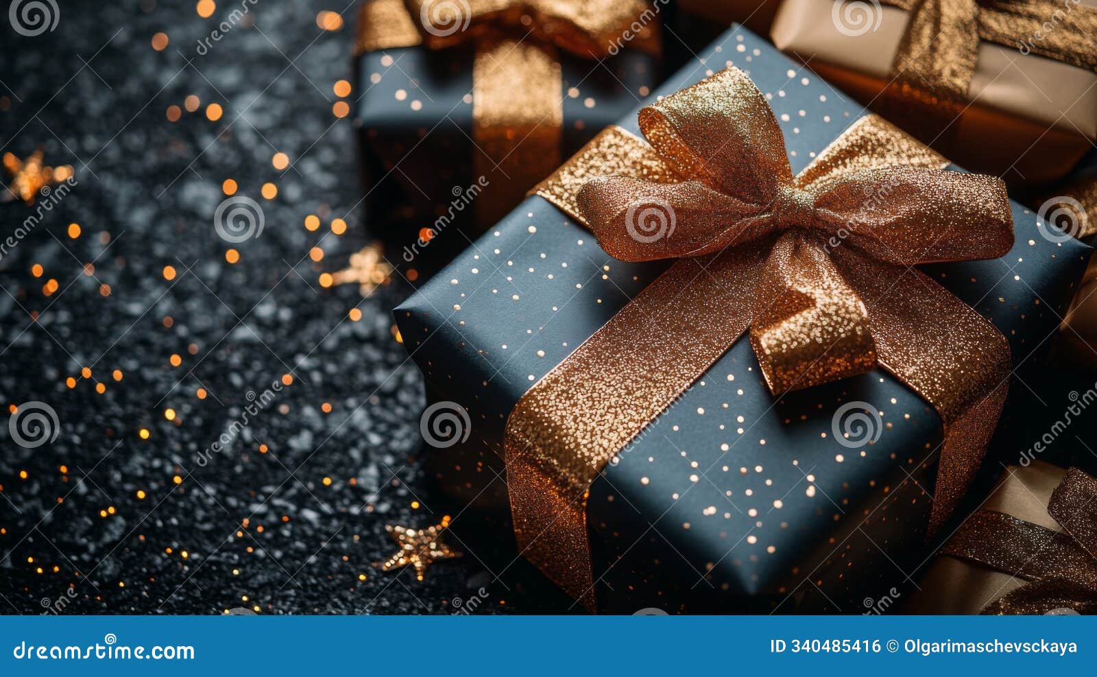 Blue Box with Gold Ribbons and Gold Bow on Dark Surface, Surrounded by ...