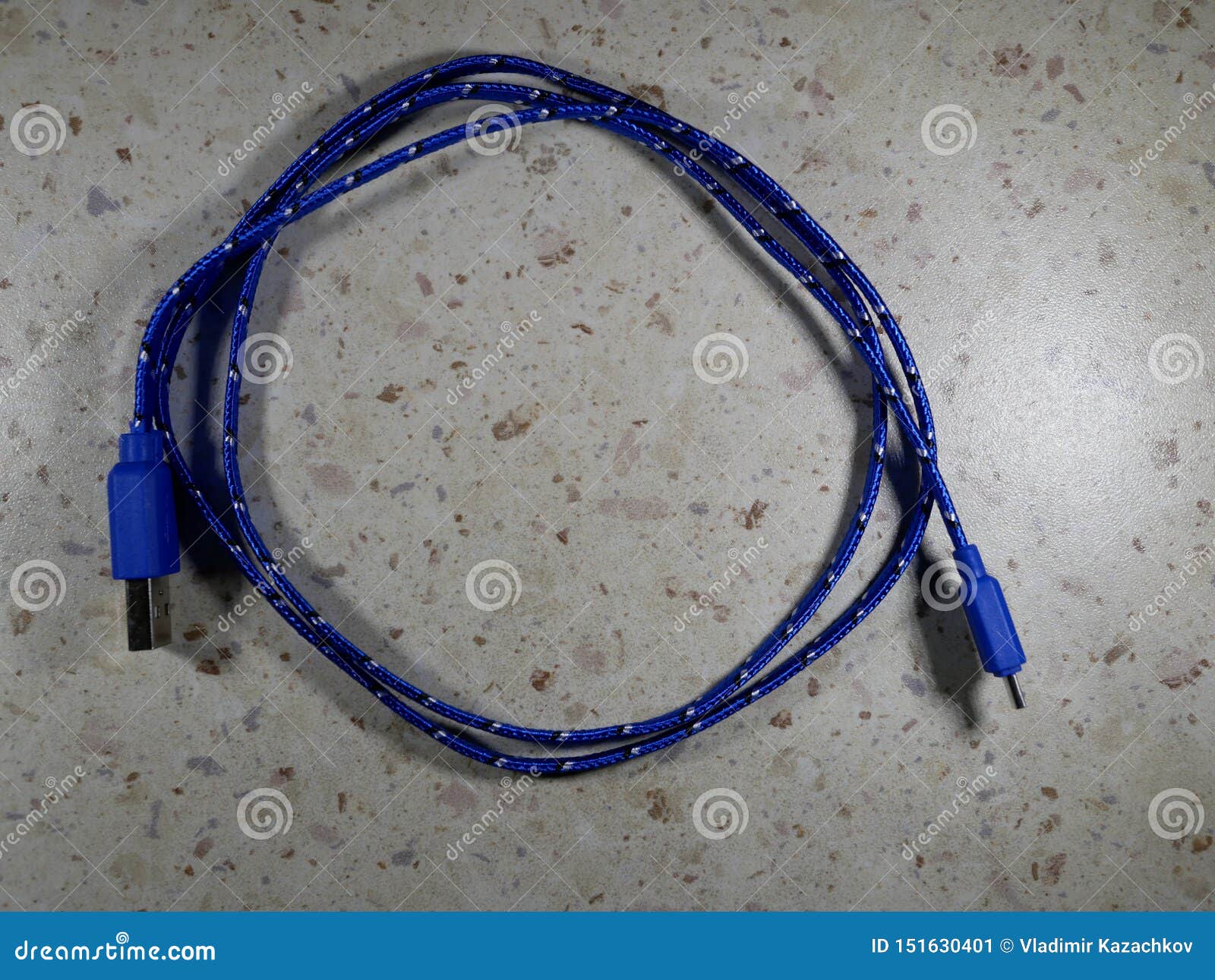 Blue Braided USB Cable with White Dots on Light Background with Specks ...
