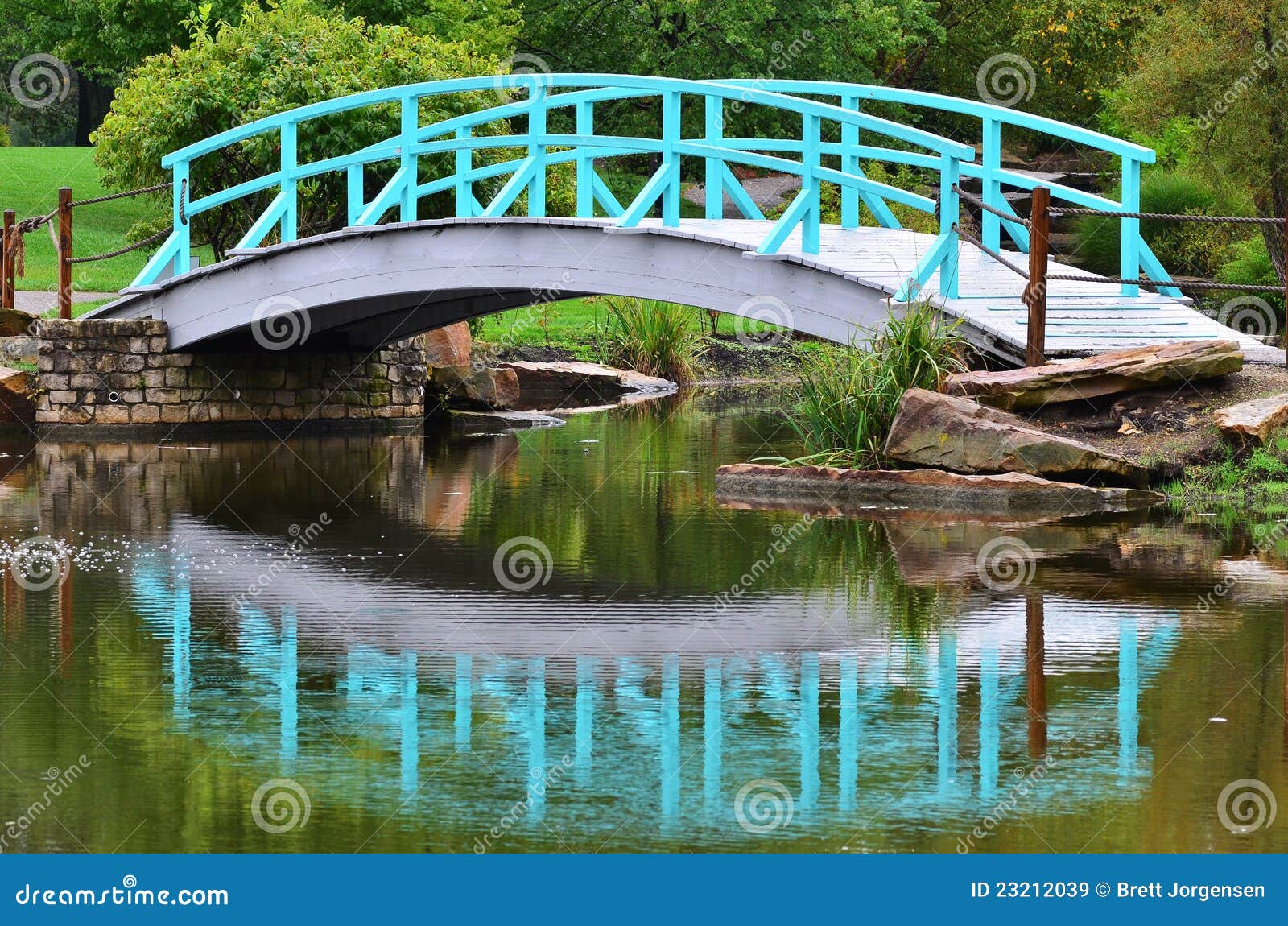 Blue Bridge Over Pond stock image. Image of green, cloud - 23212039