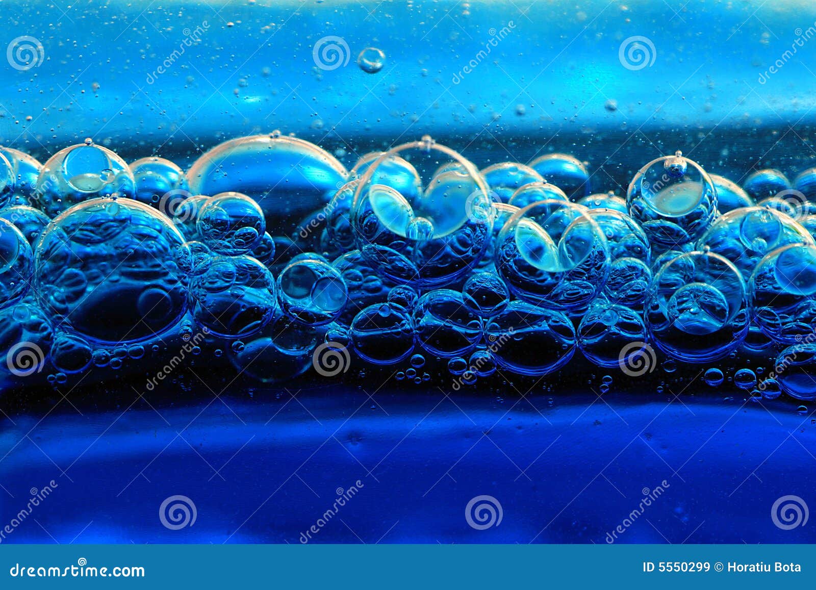 Blue bubbles stock image. Image of rainbow, soapy, surface - 5550299