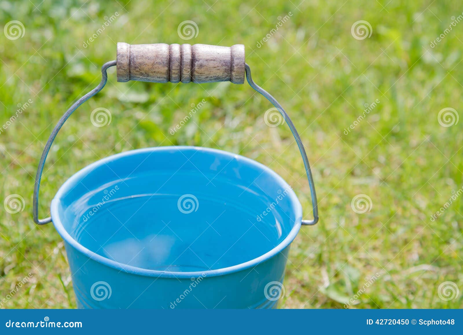 Blue bucket of water stock photo. Image of painted, outdoors - 42720450