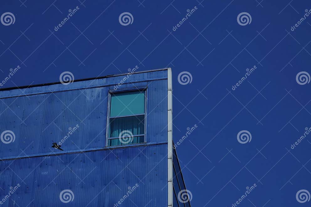 Blue Building and Window on a Blue Sky Background Stock Photo - Image ...