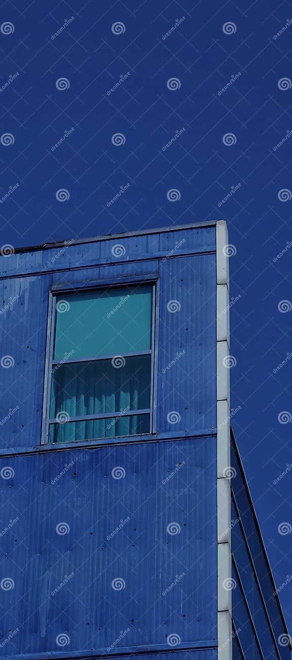 Blue Building and Window on a Blue Sky Background Stock Photo - Image ...