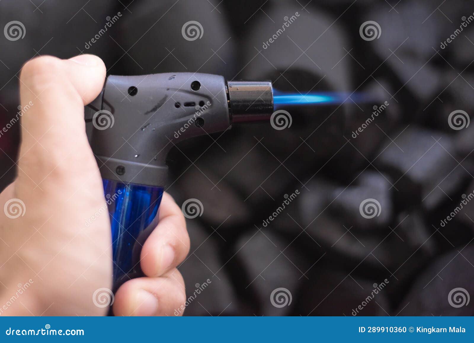 The Blue Burner Lighter that is Being Activated To Burn. the Background ...